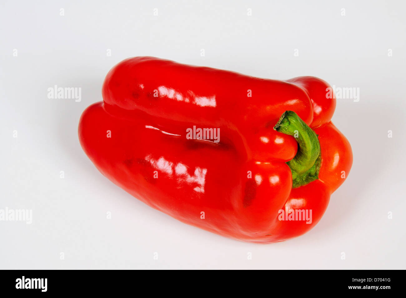 Red Capsicum against a white background Stock Photo - Alamy