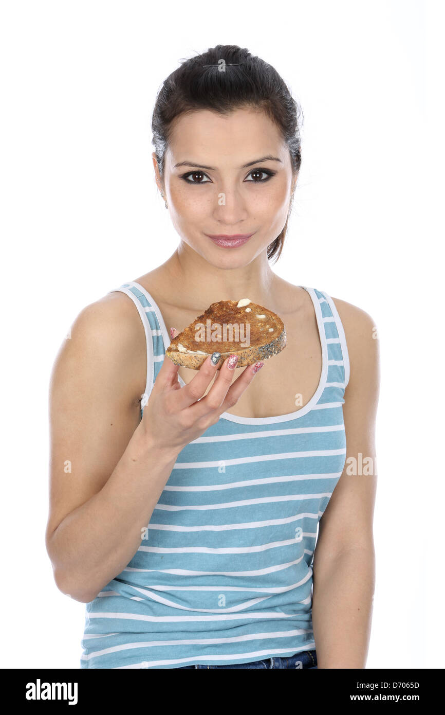 Model Released. Woman Eating Buttered Toast Stock Photo - Alamy