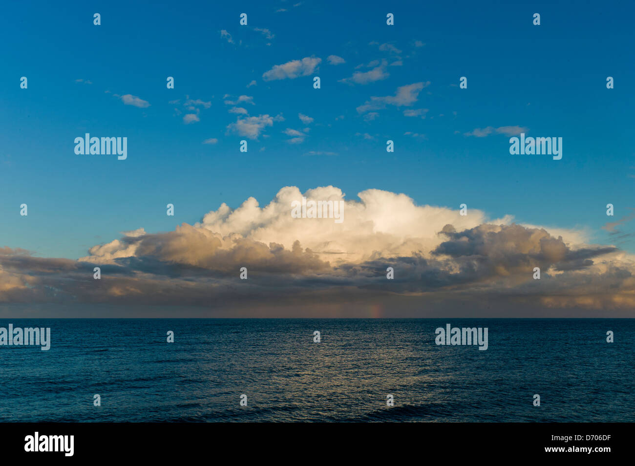 Cloud over sea, morning,distant rain, rainbow, Normandy, France Stock ...