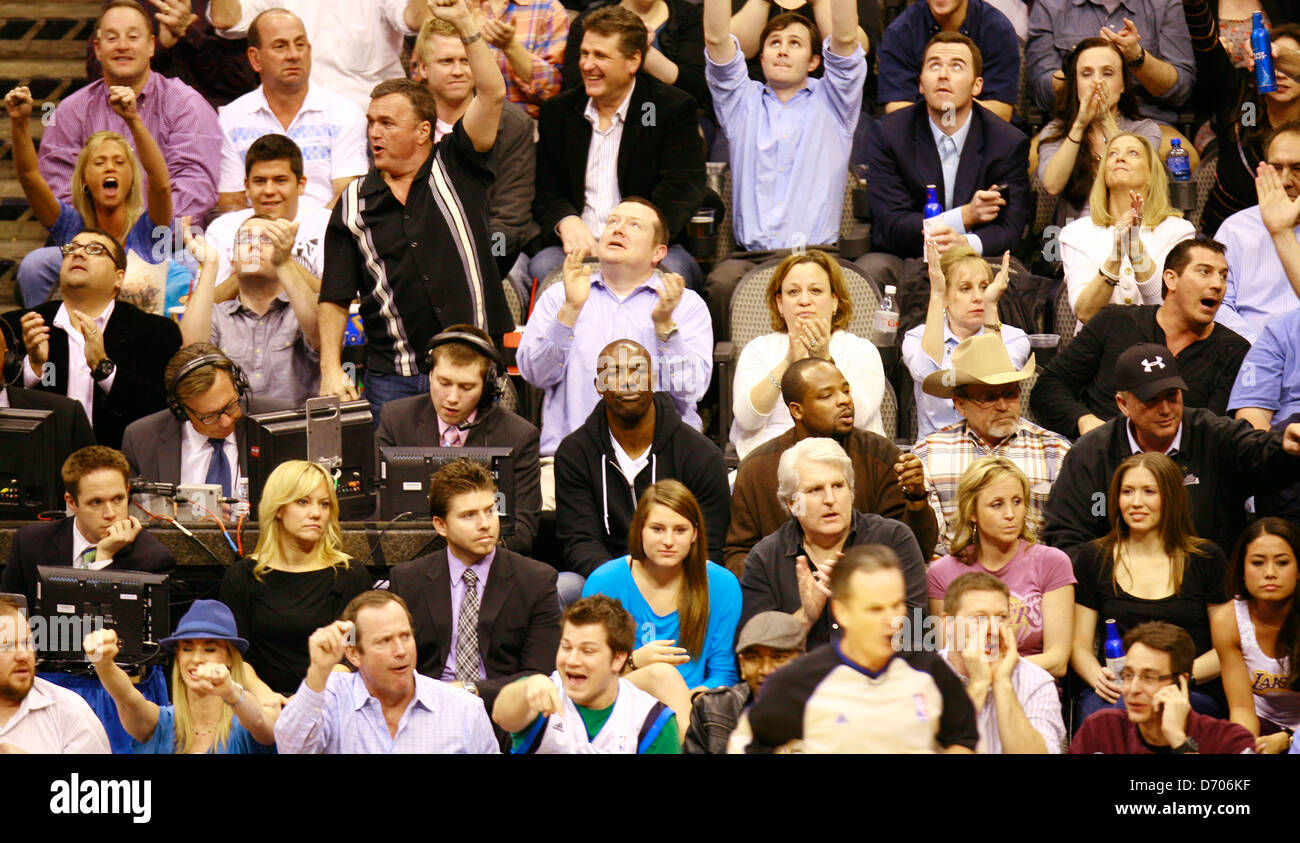 Ex-NFL player Terrell Owens watches an NBA basketball game between the ...