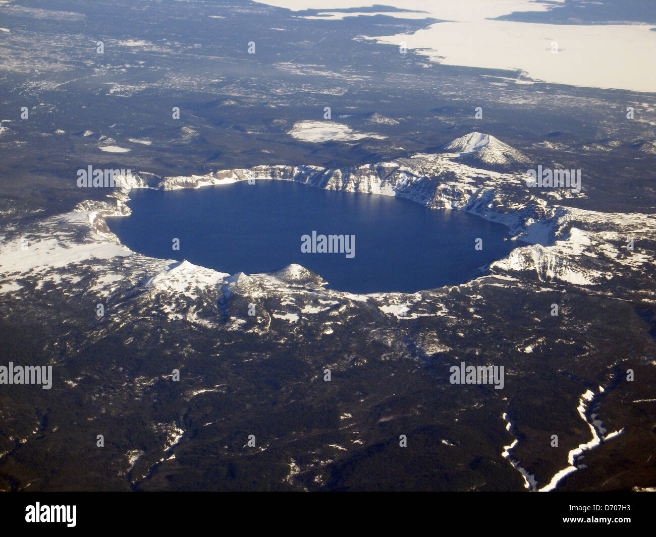 This aerial image of Crater Lake shows the stunning blue waters and the ...