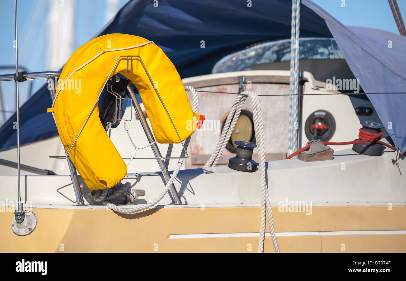 Yellow lifebuoy on sailing yacht Stock Photo - Alamy