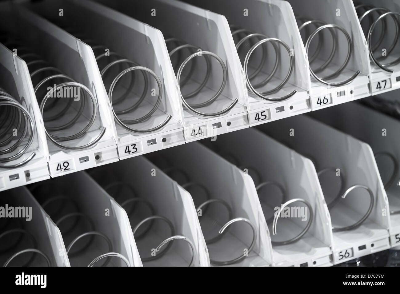 Empty shelf of office vending machine Stock Photo - Alamy