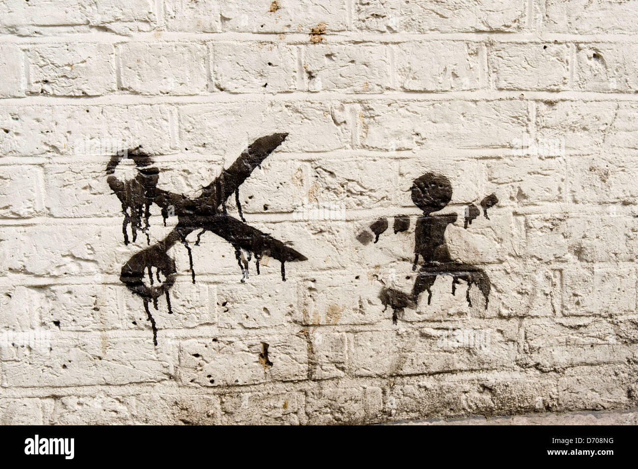 street art showing man being chased by scissors Stock Photo - Alamy