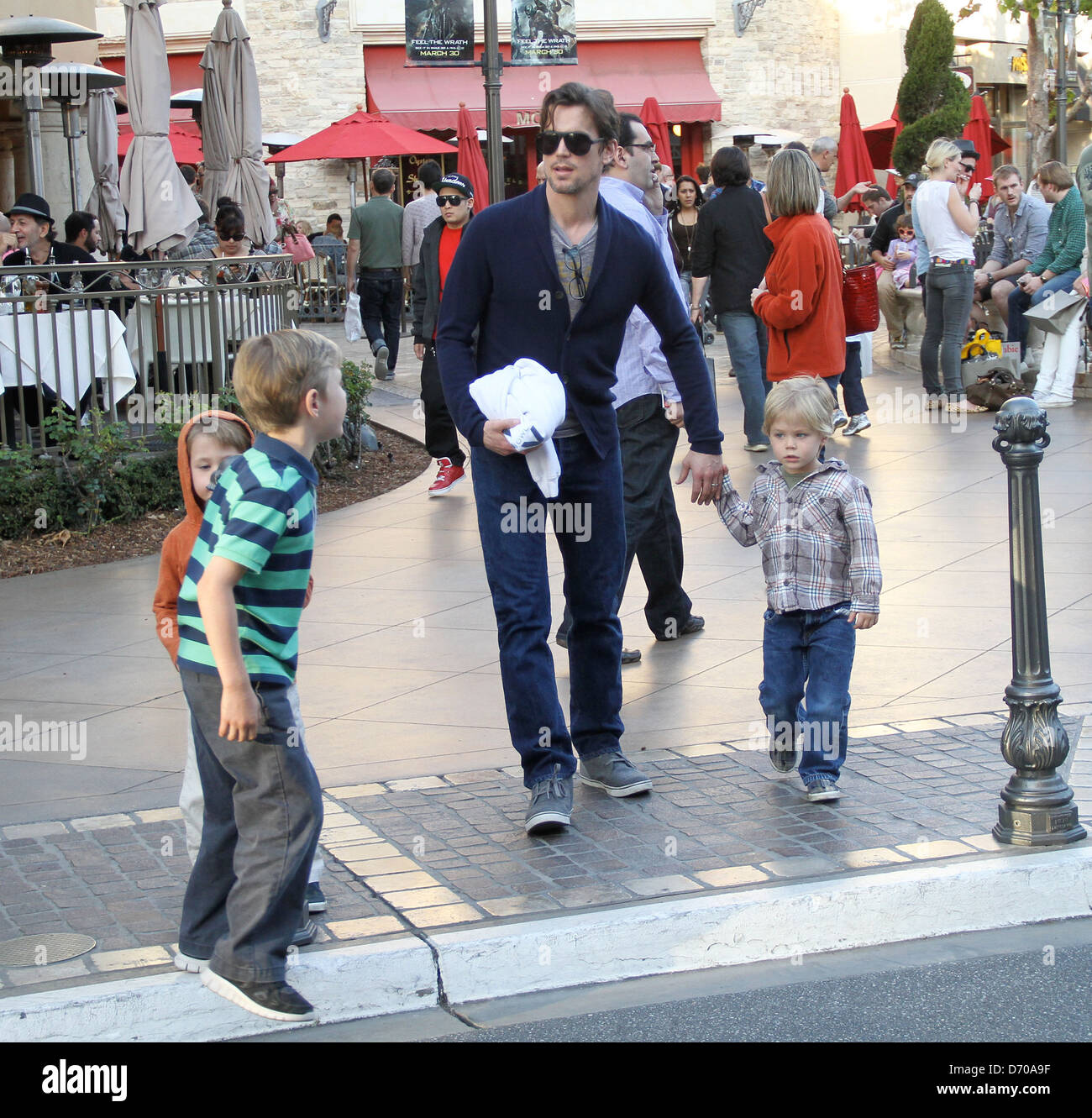 Matt Bomer heading to the movie theater at The Grove with his children ...