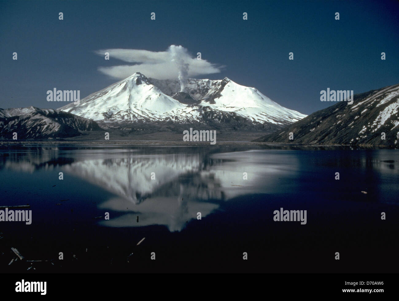 This image captures the serene reflection of Mount St. Helens in Spirit ...