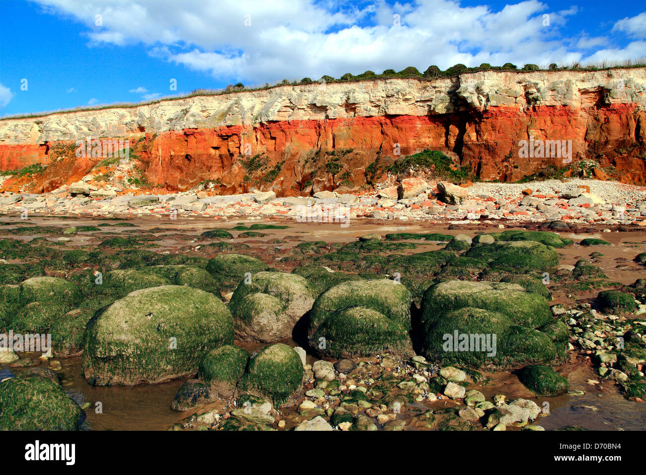 Old Hunstanton Cliffs, coloured layers, low tide, Norfolk. Striped ...