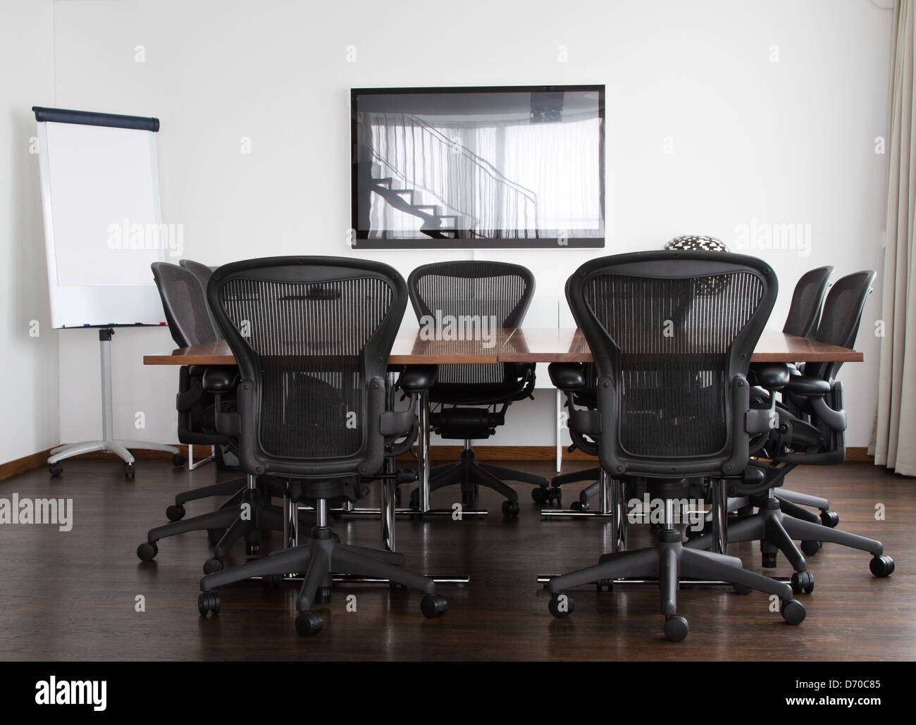 Conference room with chairs, table and drawing pad Stock Photo - Alamy