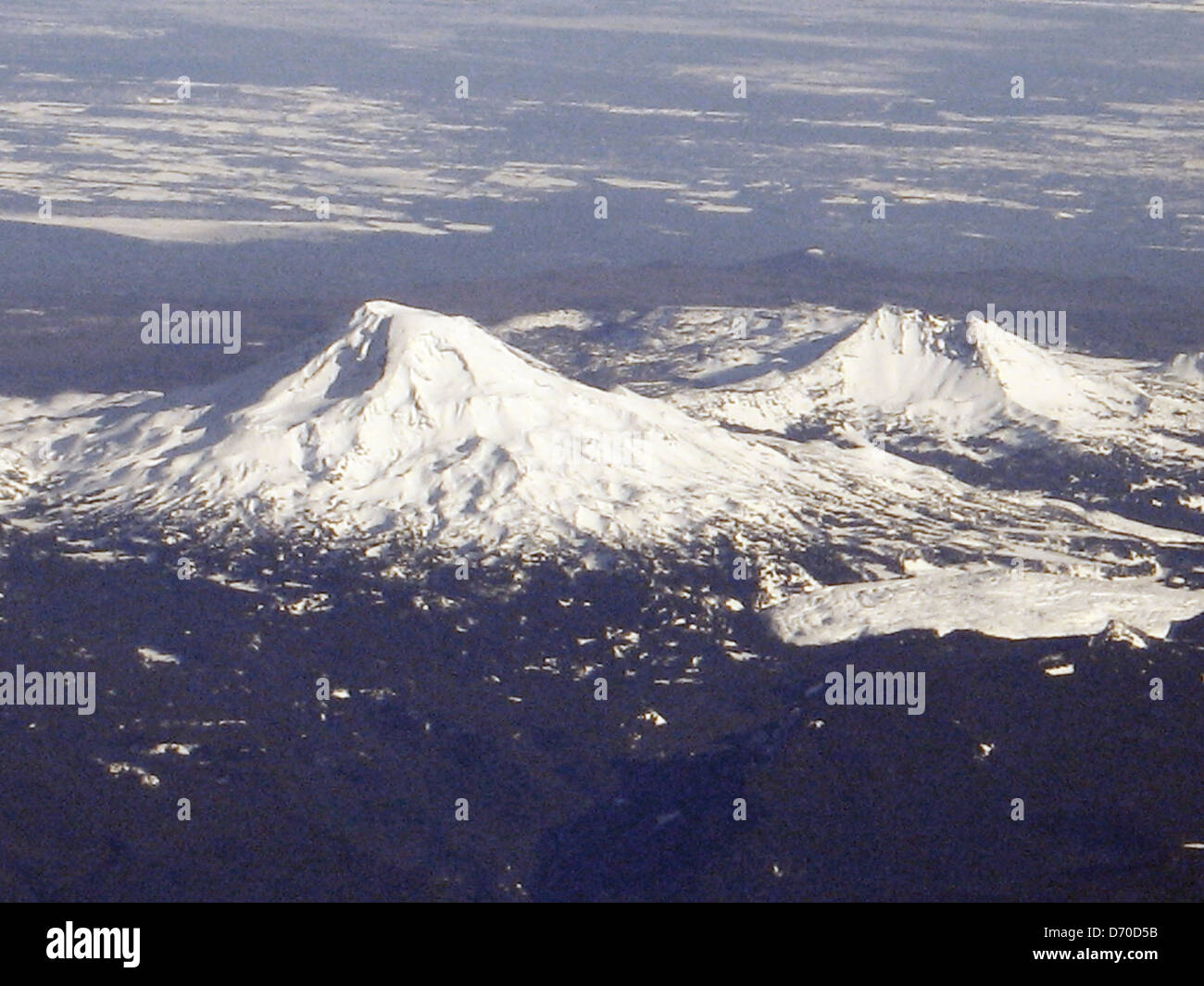 The aerial view of South Sister and Broken Top showcases two prominent ...