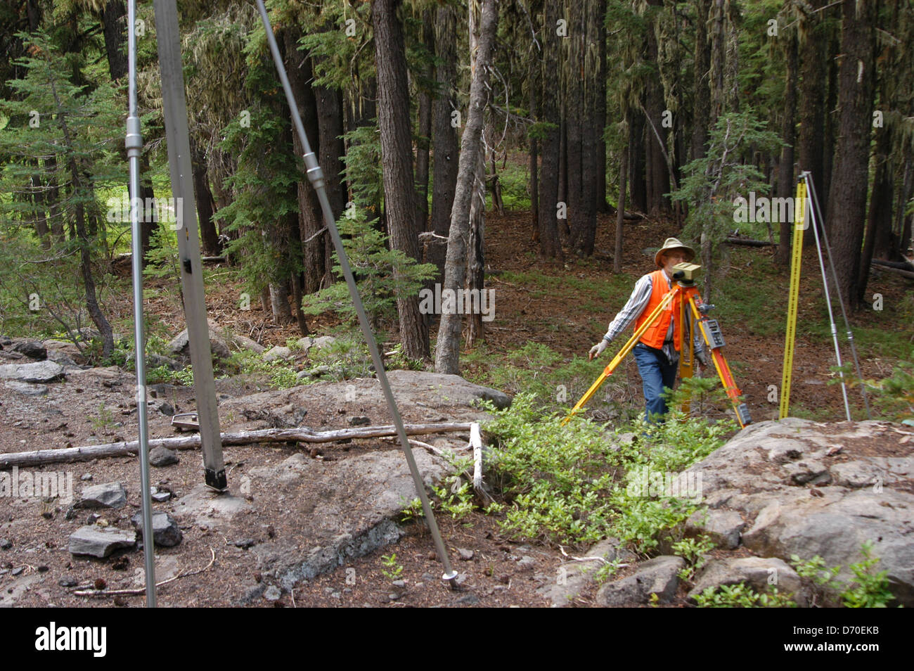A USGS team conducts a leveling survey on a volcanic mountain on August ...
