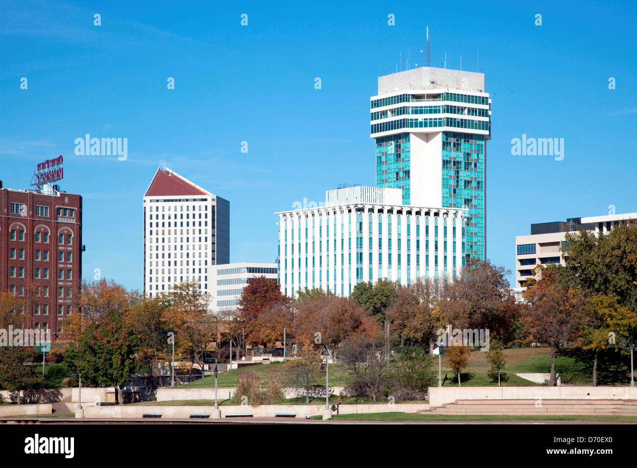 USA, Kansas, Wichita, Skyline along waterfront of Arkansas River Stock ...