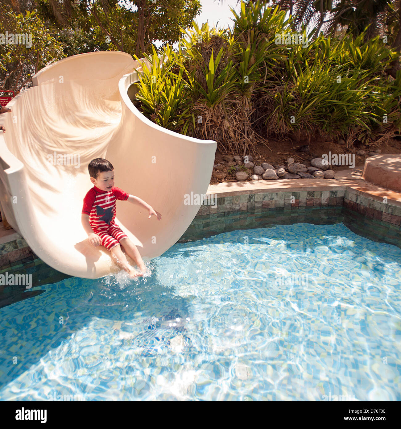 Boy water slide hi-res stock photography and images - Alamy