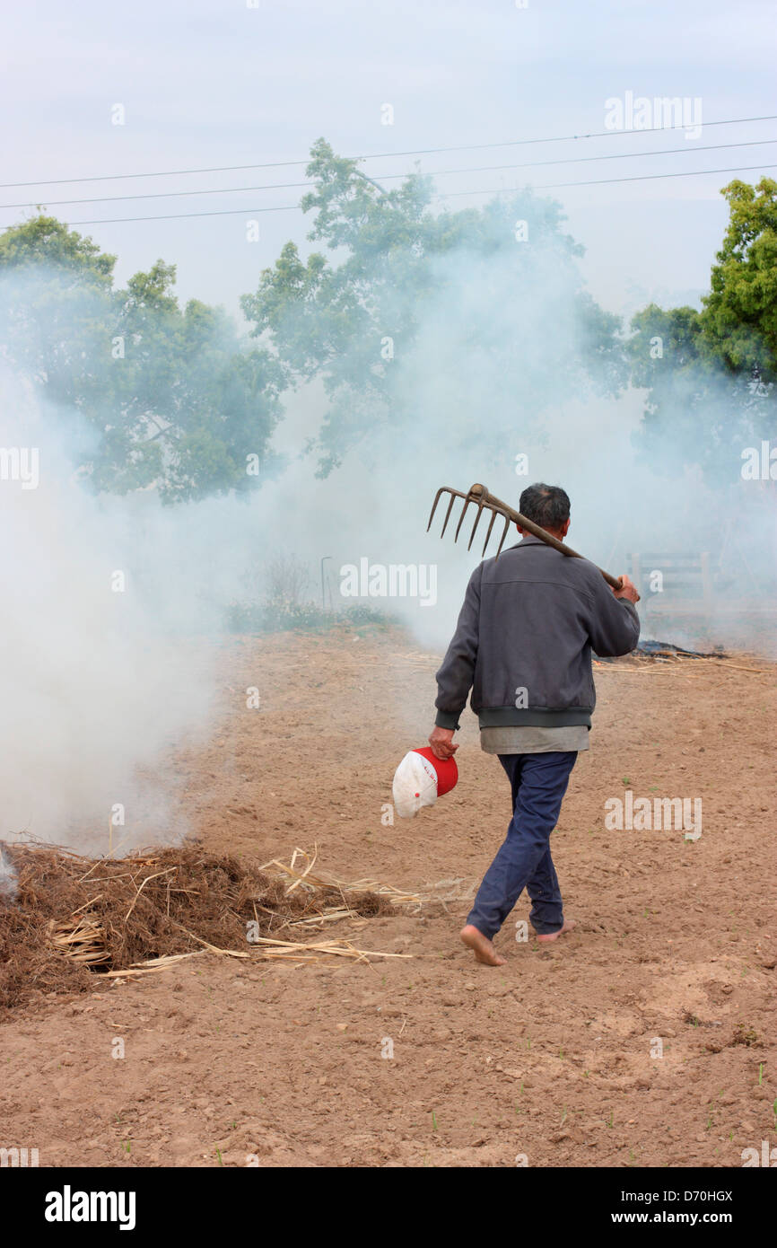 Farmer with rake on field hi-res stock photography and images - Alamy