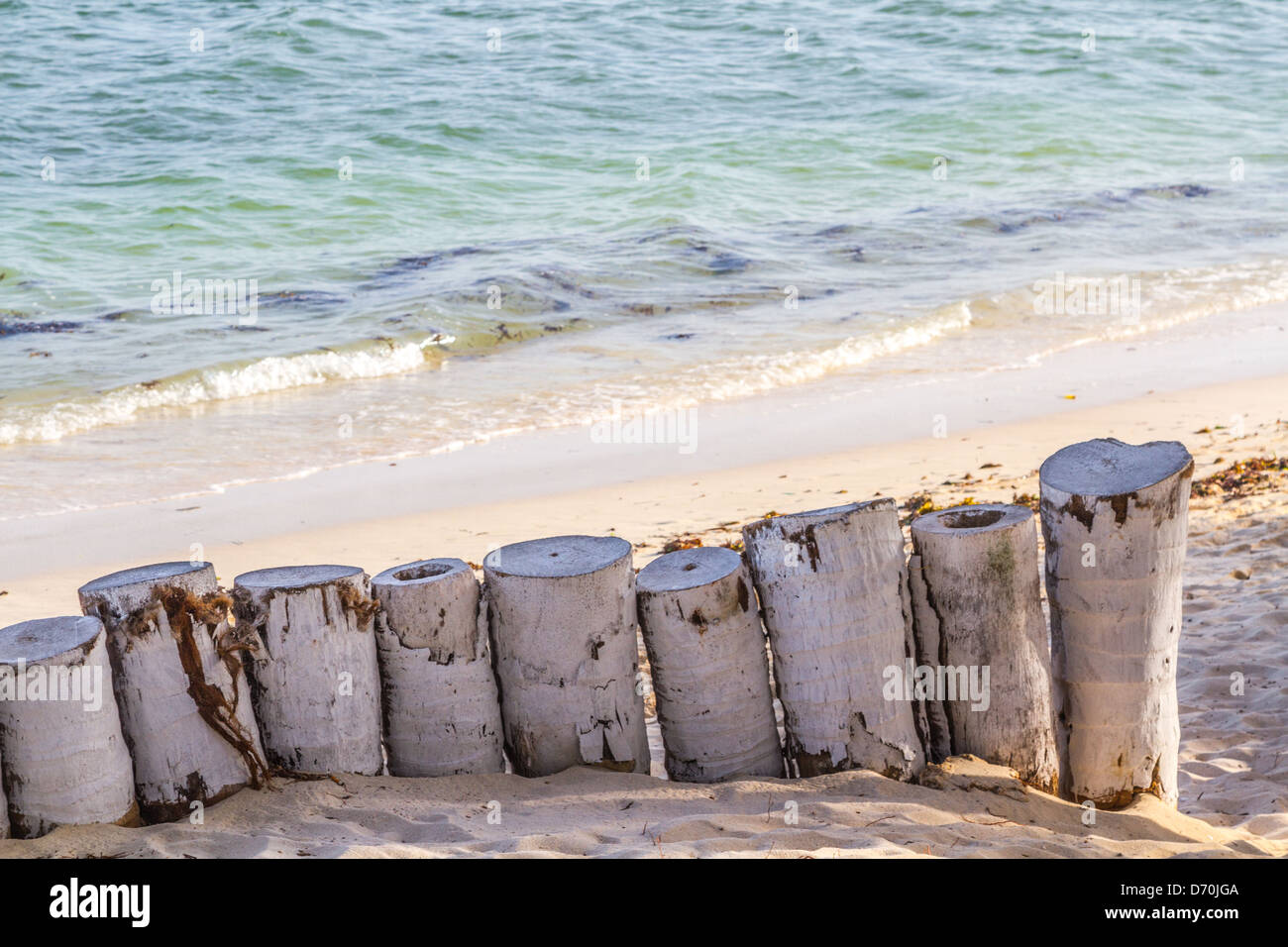 rows of piles on the sea beach - outdoor Stock Photo - Alamy