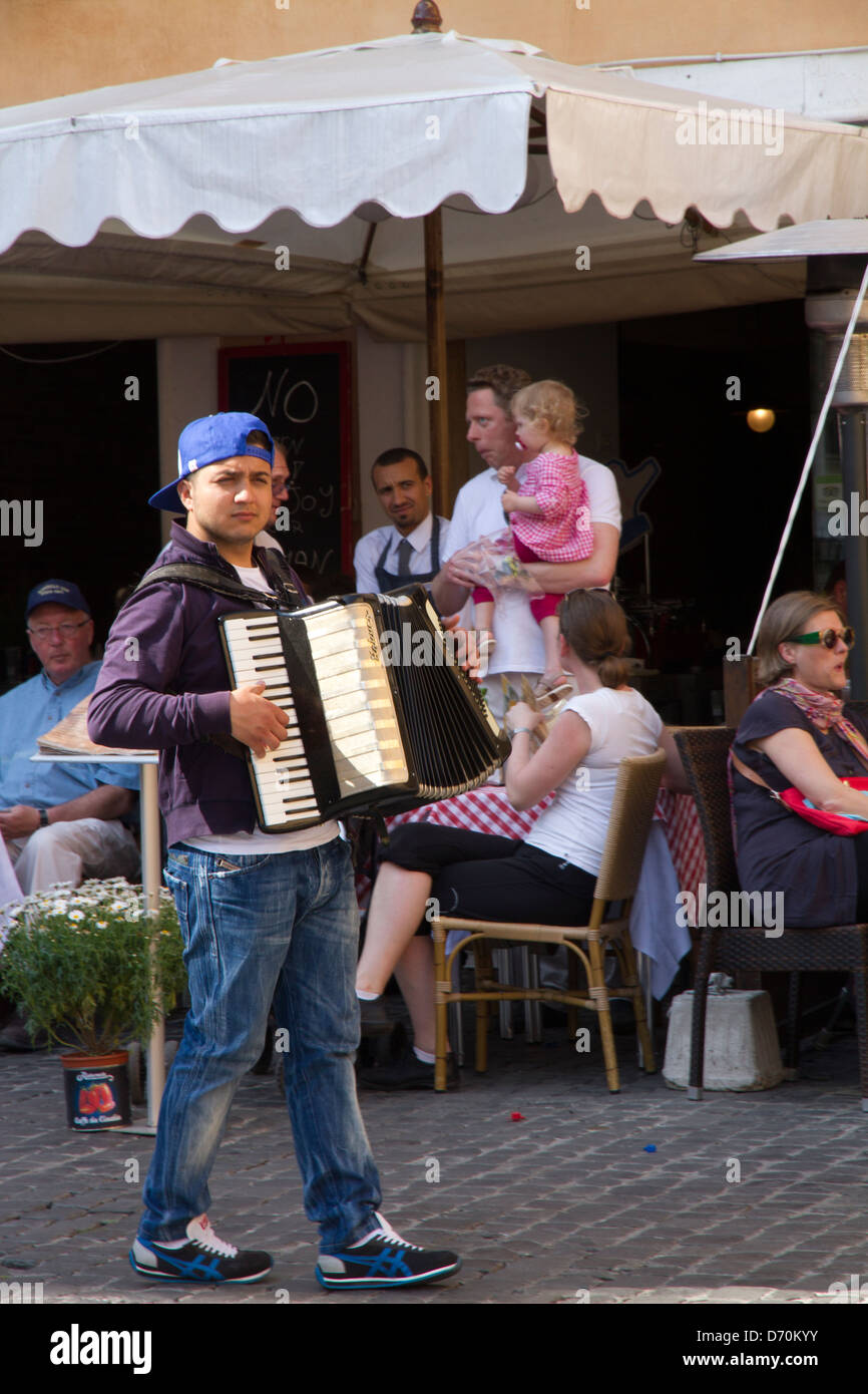 Rome boy playing accordion in street Stock Photo - Alamy