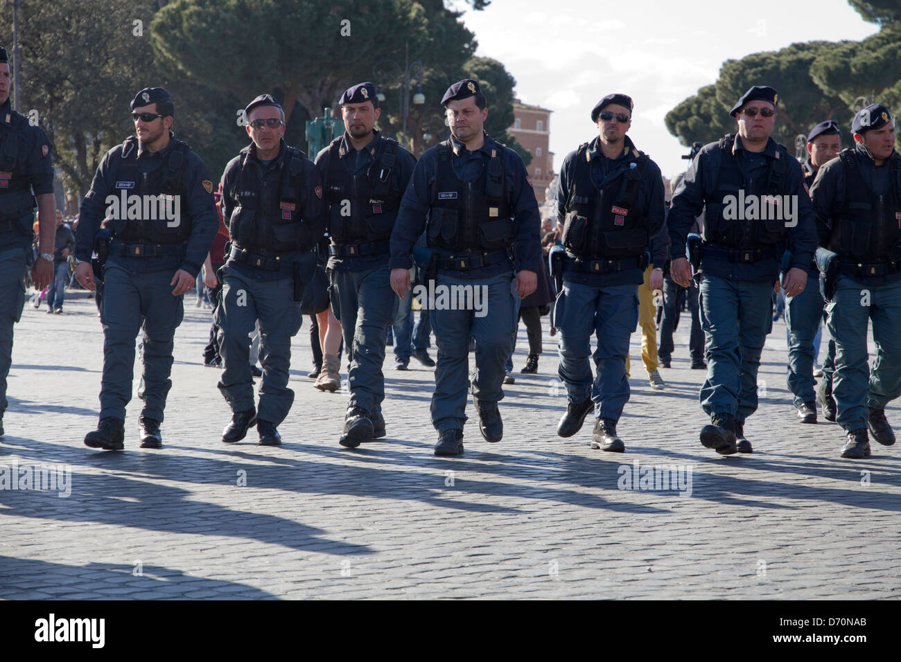 police officers group walking Italy Stock Photo - Alamy