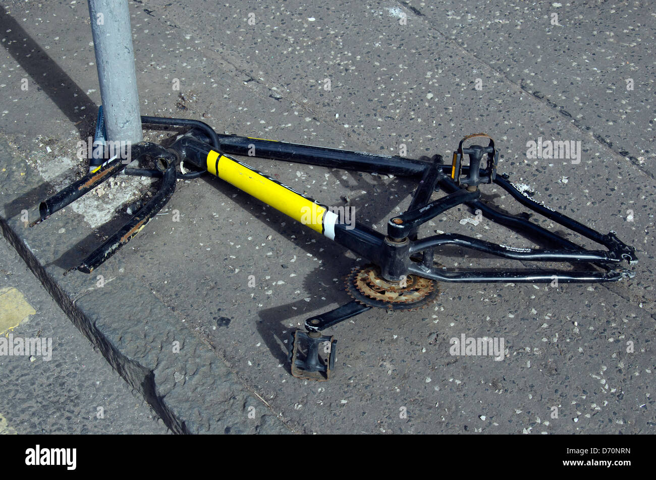 The remains of an abandoned, vandalised and stripped bicycle in ...
