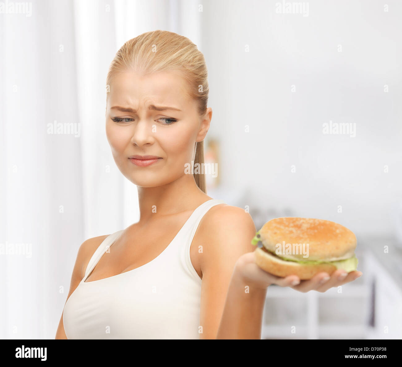 woman rejecting junk food Stock Photo - Alamy