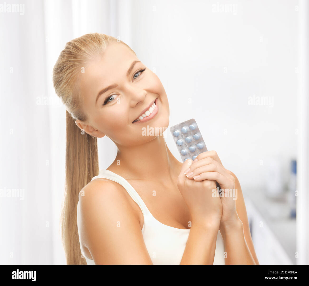 young woman with one pack of pills Stock Photo - Alamy