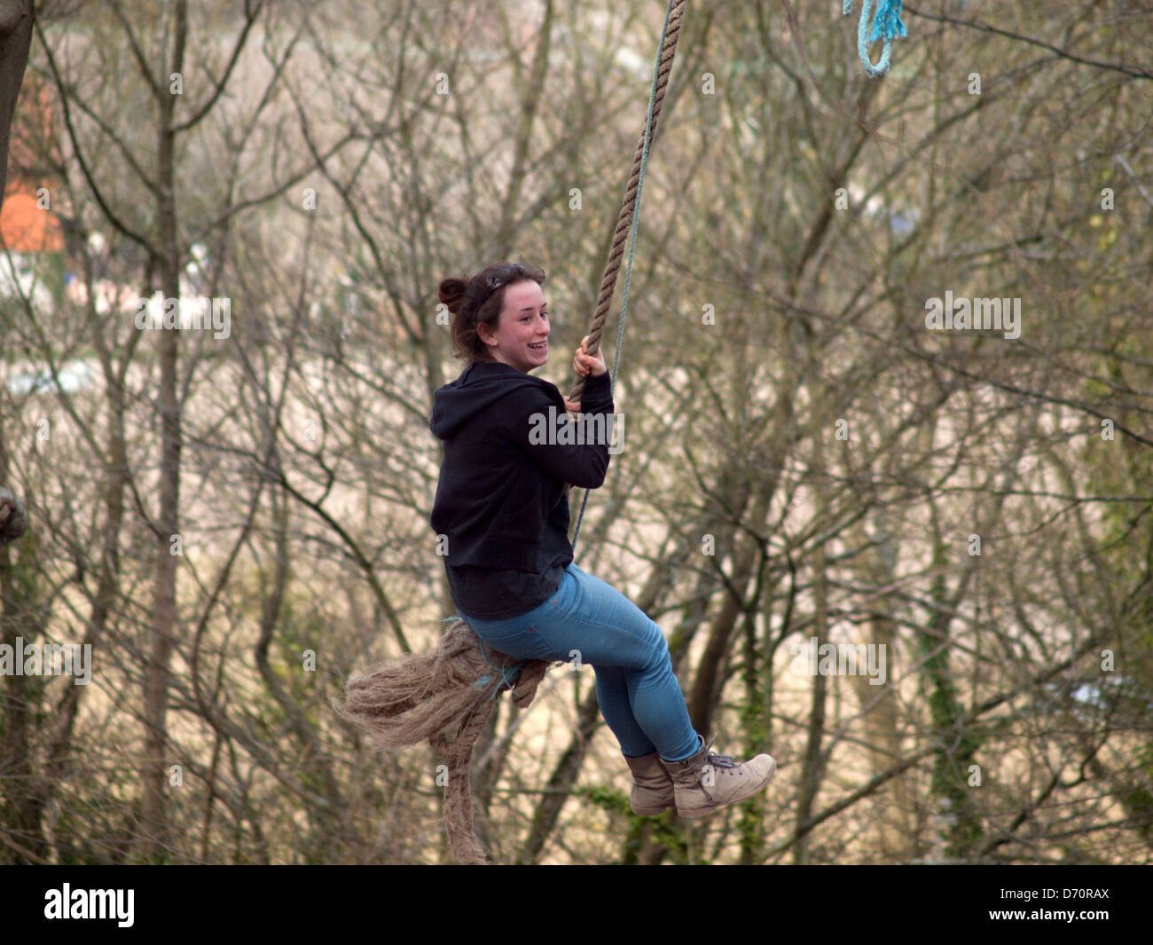 Children swinging on rope hi-res stock photography and images - Alamy