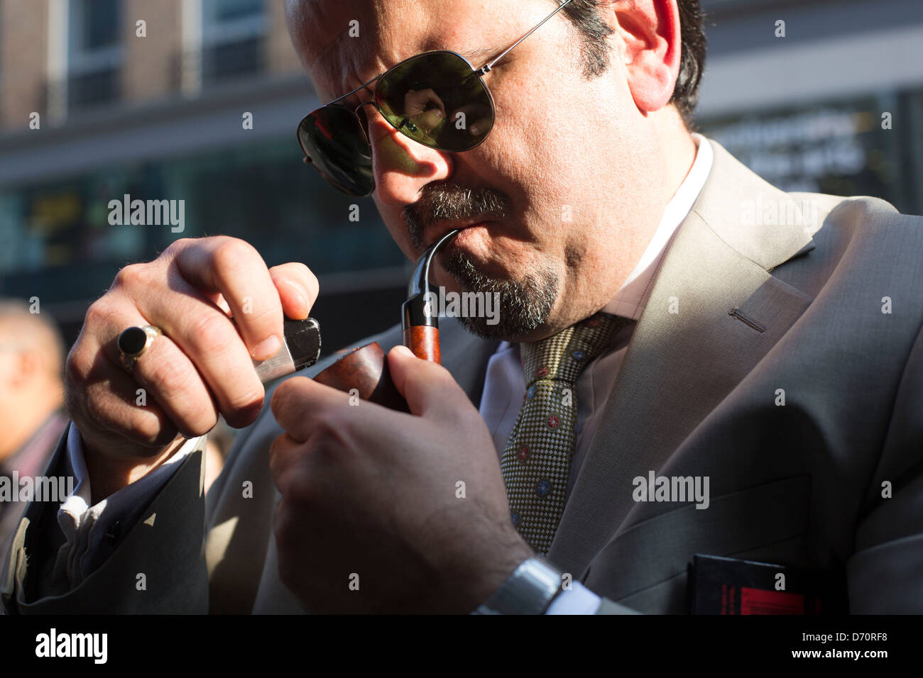 Man smoking a pipe. Foreign journalist reporting on Horse Racing Stock ...