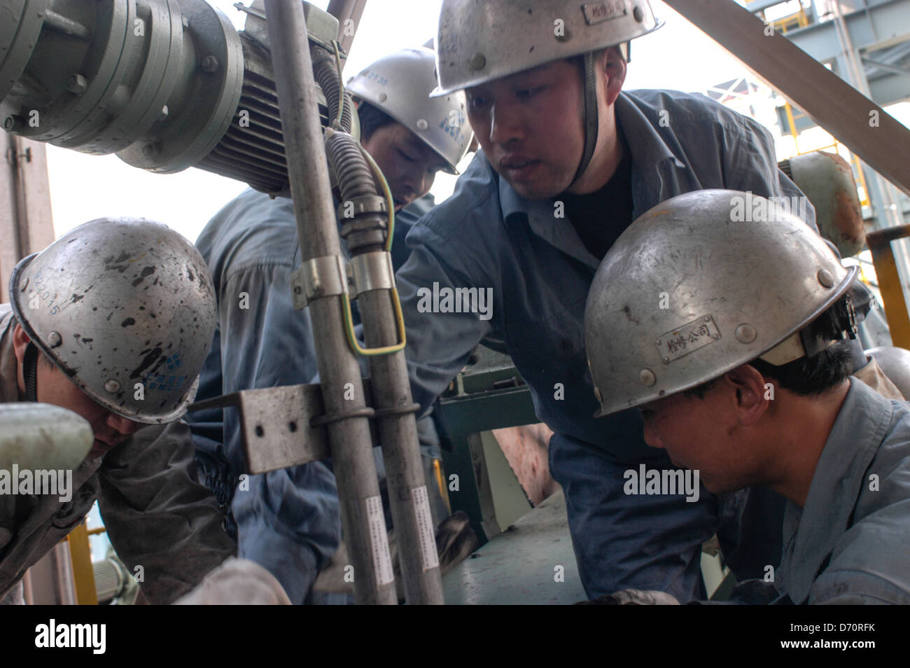 Workers at work at the Baosteel steelworks outside Shanghai, China ...