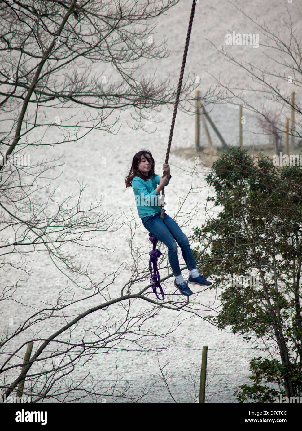 Children playing on tree swing hi-res stock photography and images - Alamy