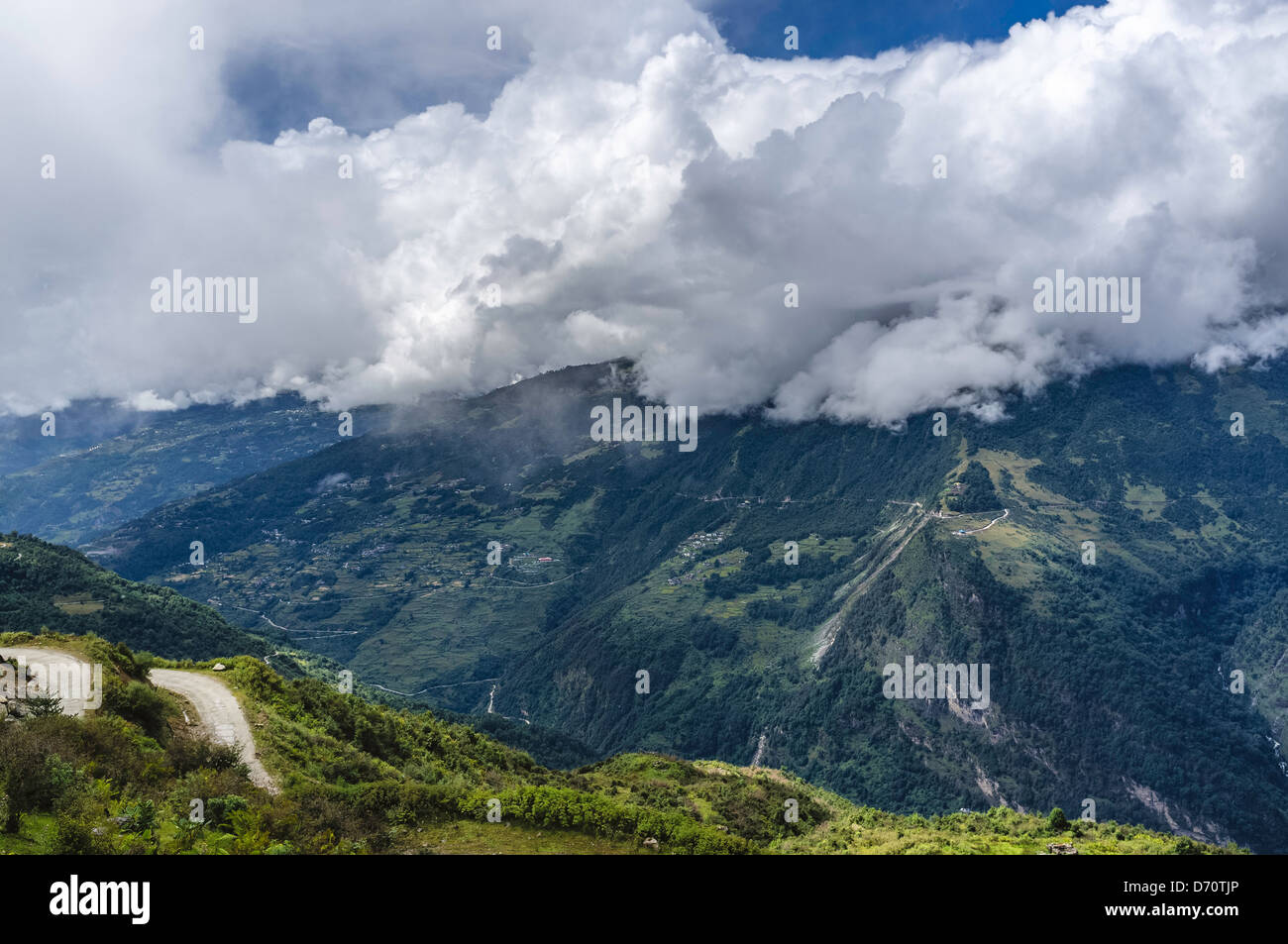 View of the high mountains and clouds, and a glimpse of the main road ...