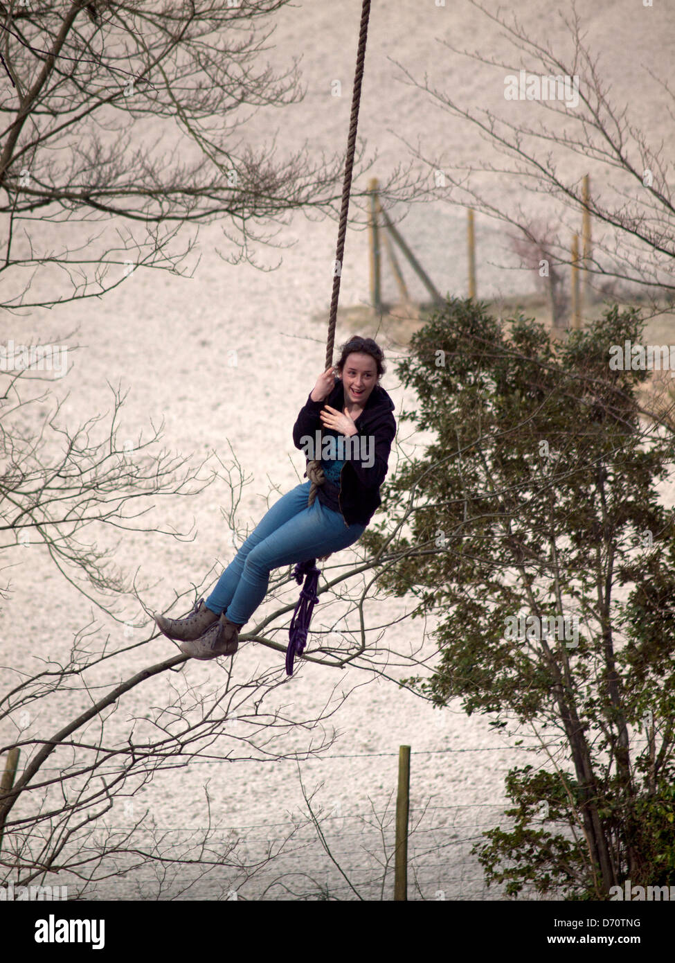 Boy girl on tree swing hi-res stock photography and images - Alamy