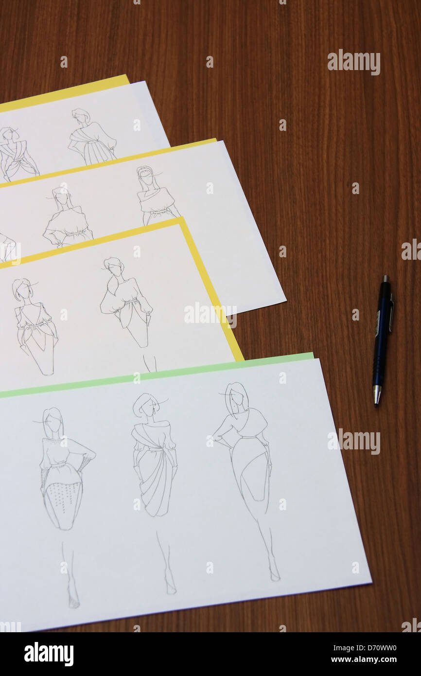 designer assessing fashion drawings on the collection of clothes Stock ...