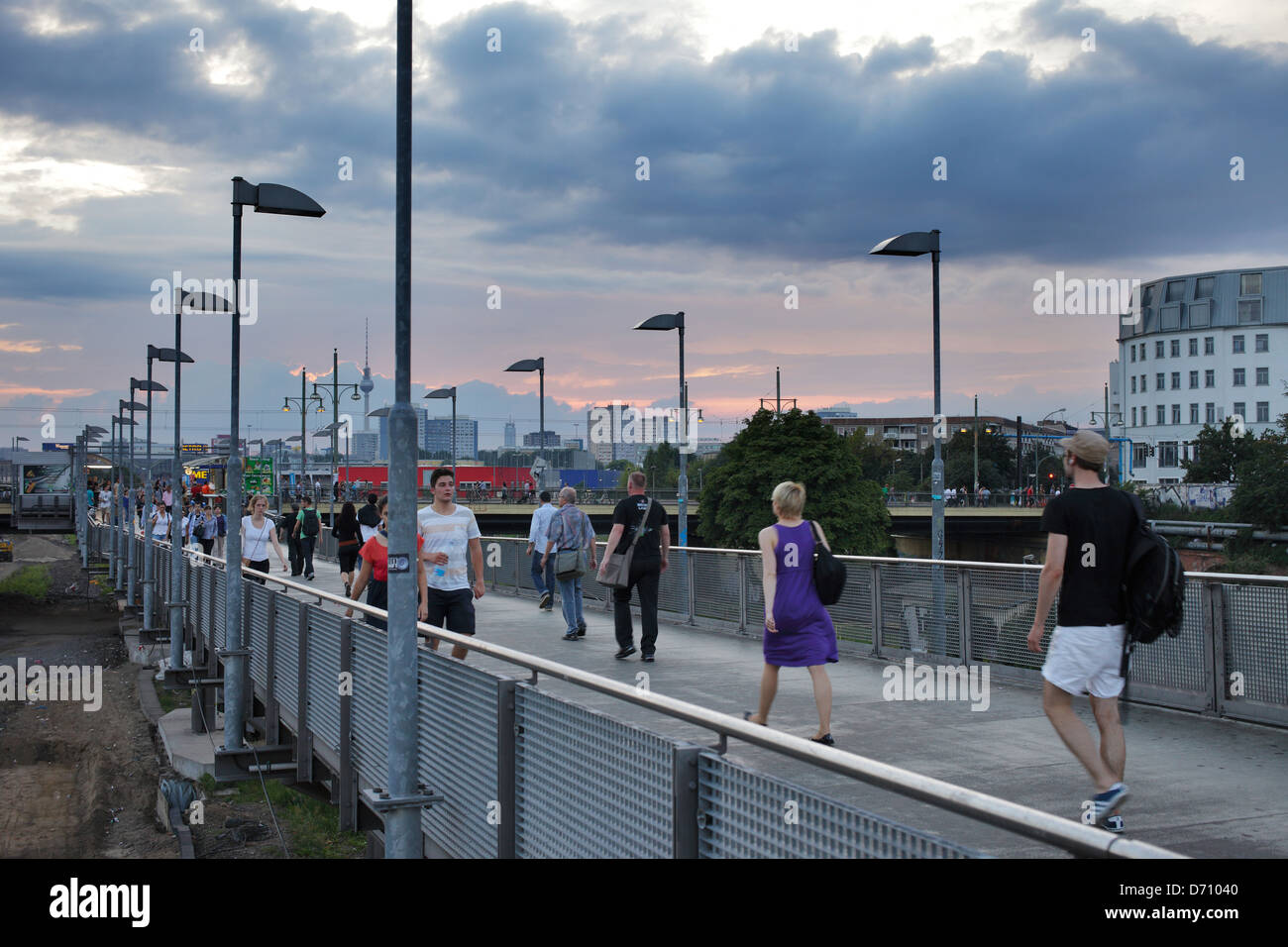 Berlin, Germany, Passengers on the footbridge at the Warschauer Strasse ...