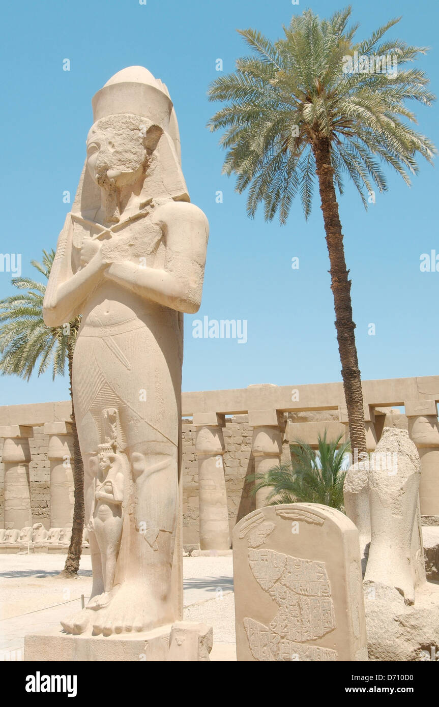 Statue of Ramses II with his daughter Meritamen, Karnak Temple Complex ...