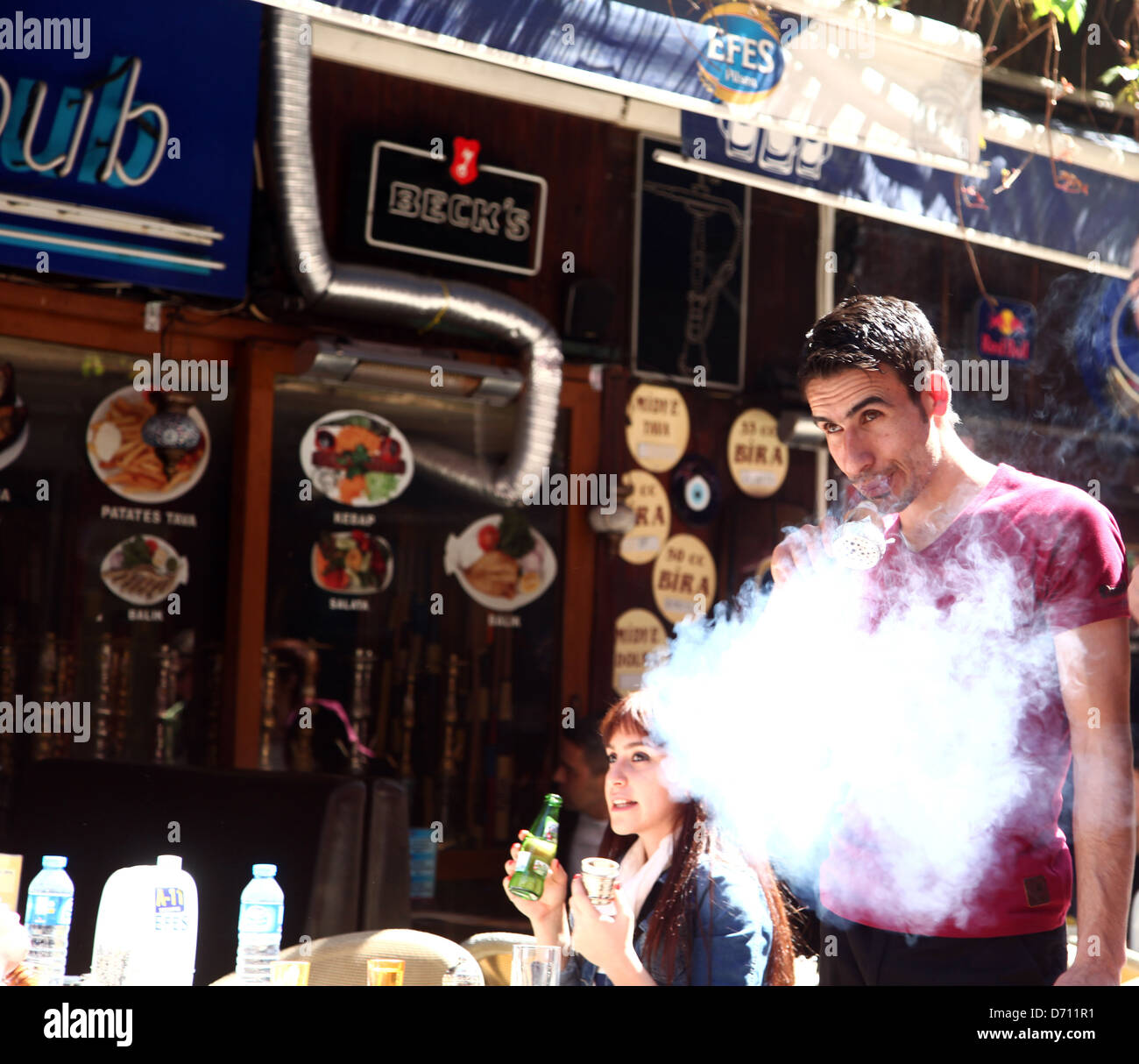 Waiter at a Turkish street Café in Istanbul preparing a traditional ...