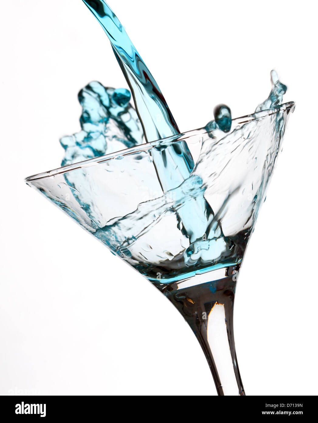 alcohol splash martini glass macro close up on white background Stock ...