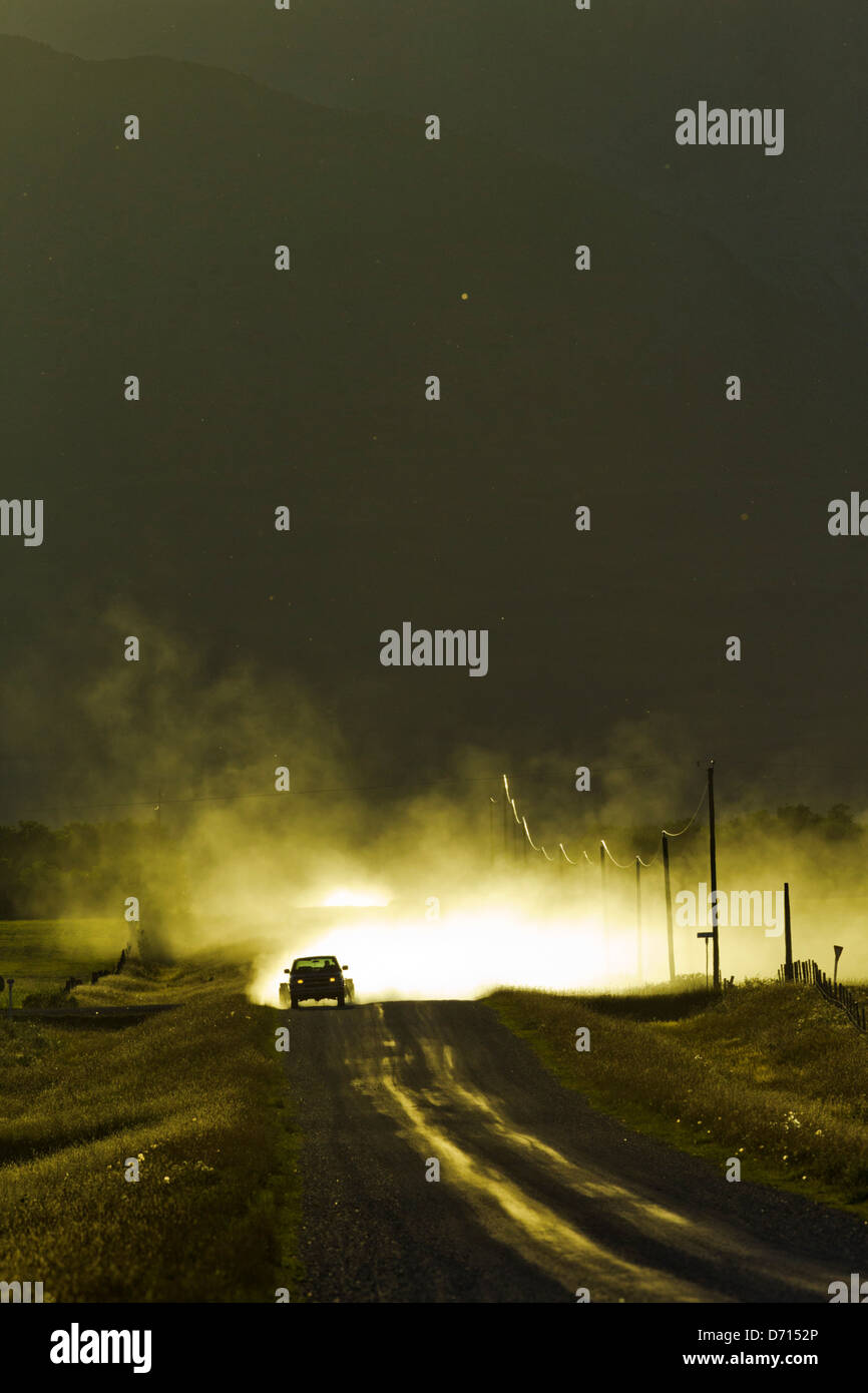 Canada, Alberta, Vehicle creating dust on country road Stock Photo - Alamy