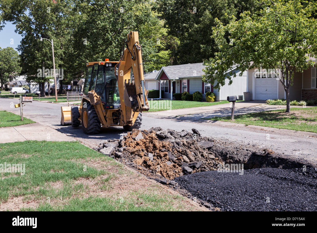 USA, Arkansas, Excavator repairing driveway Stock Photo - Alamy