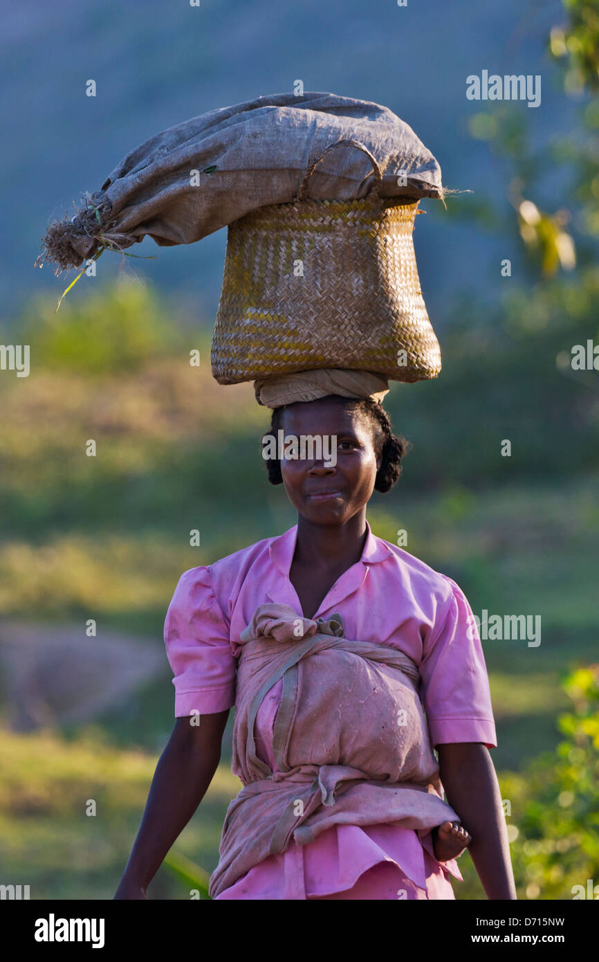 Woman carrying basket on head, Fort Dauphin, Madagascar Stock Photo - Alamy
