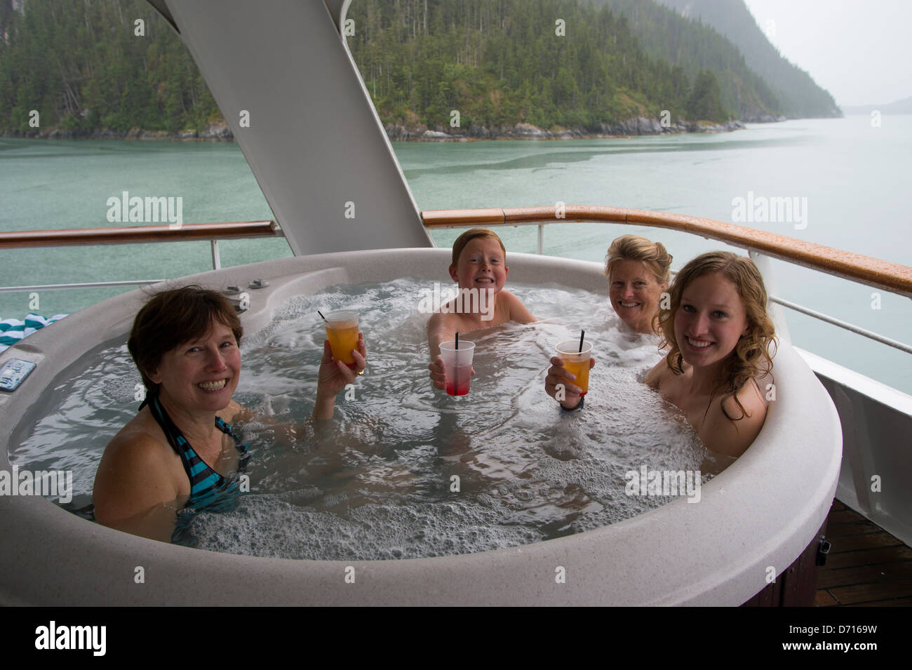 Passengers enjoying hot tub on cruise ship Safari Endeavour anchored ...