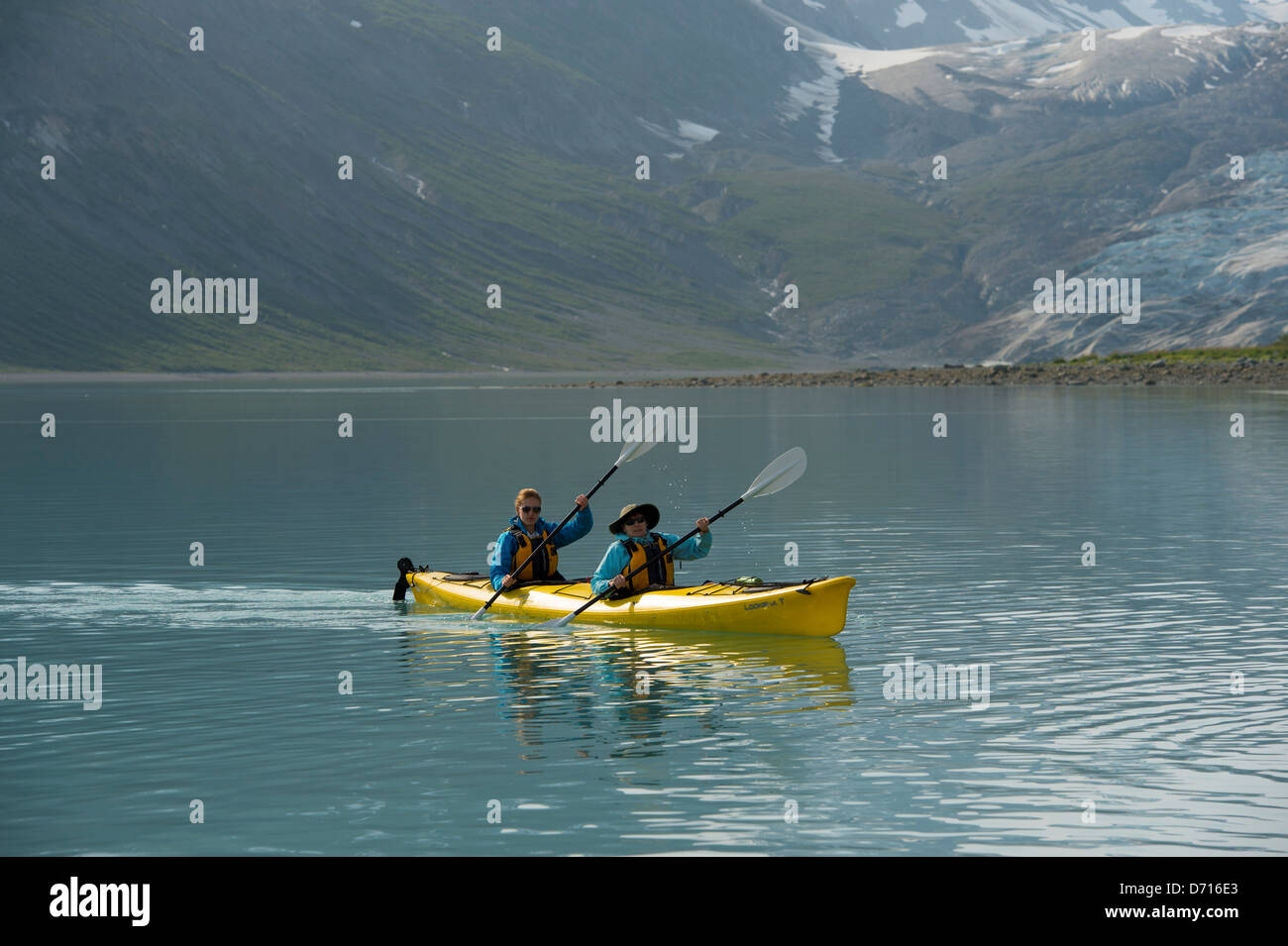 People sea kayaking near Reid Glacier in Glacier Bay National Park ...