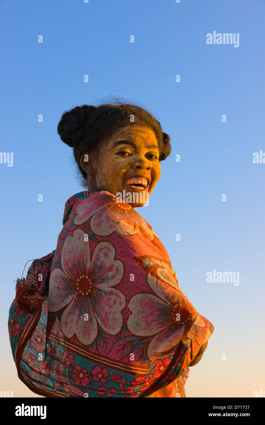 Portrait of a girl, face covered with clay power as sunblock, Morondava ...