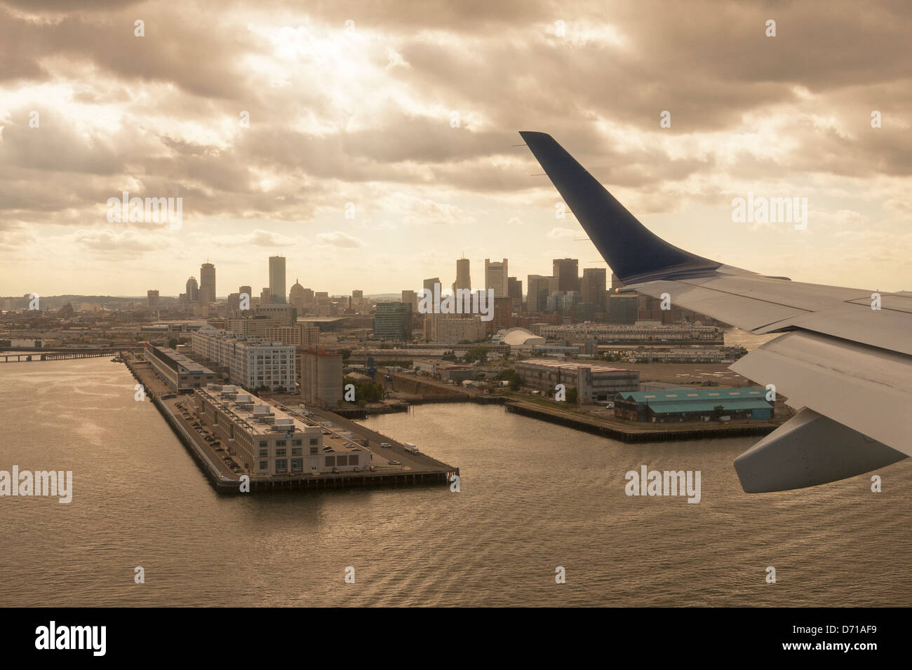 Airplane above buildings hi-res stock photography and images - Alamy