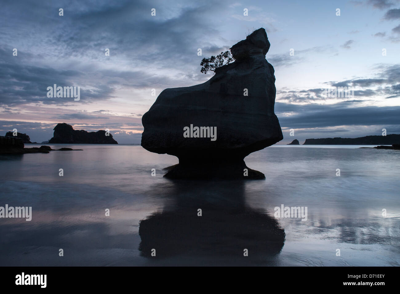 Sphinx Rock at dawn and its reflection in the beach at Mare's Leg Cove ...