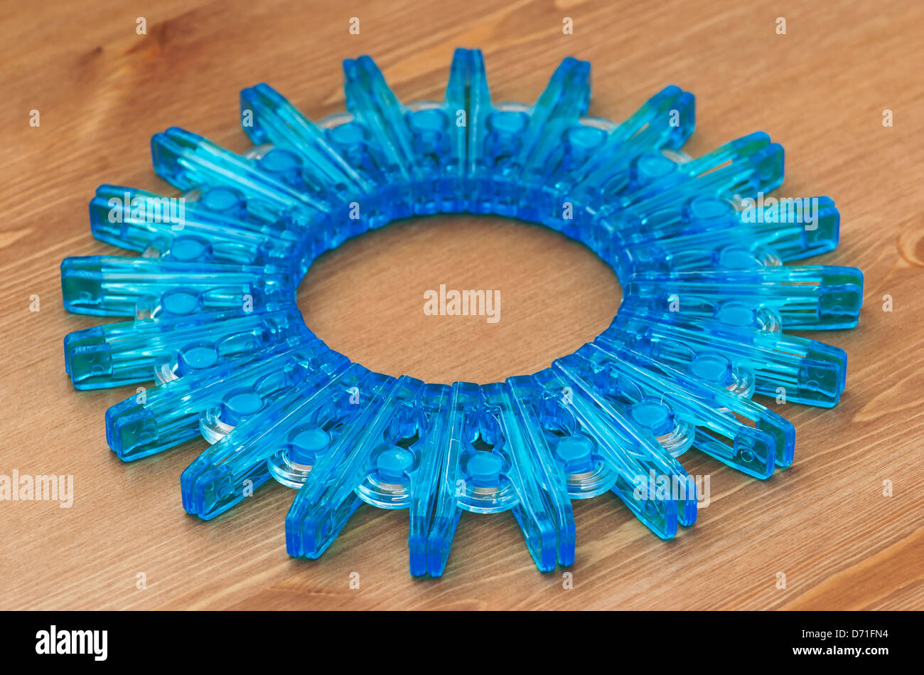 Clothes pegs stored in a circular shape Stock Photo - Alamy