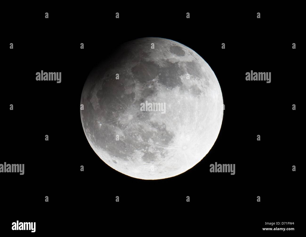 Berlin, Germany, 25th April, 2013. The partial lunar eclipse is visible at 22:07 o'clock at ...