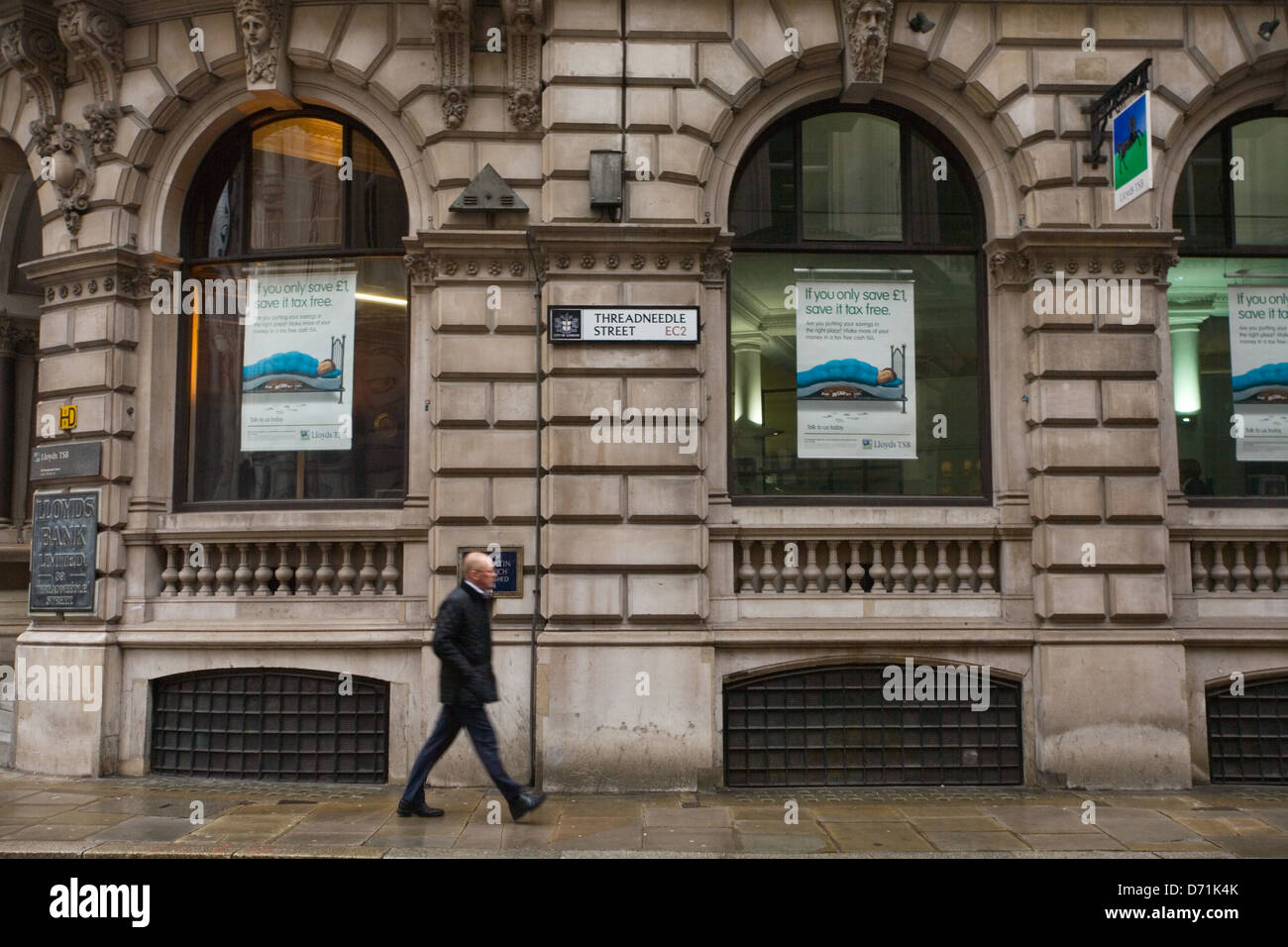 Man walking past Lloyds bank, Threadneedle Street, London Stock Photo ...