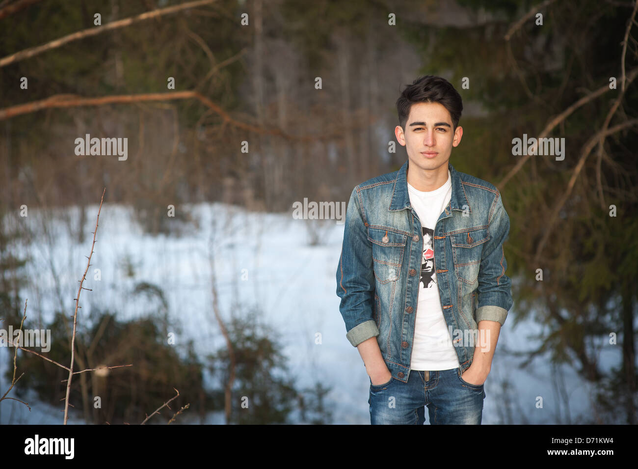 Young fashionable guy posing outside Stock Photo - Alamy