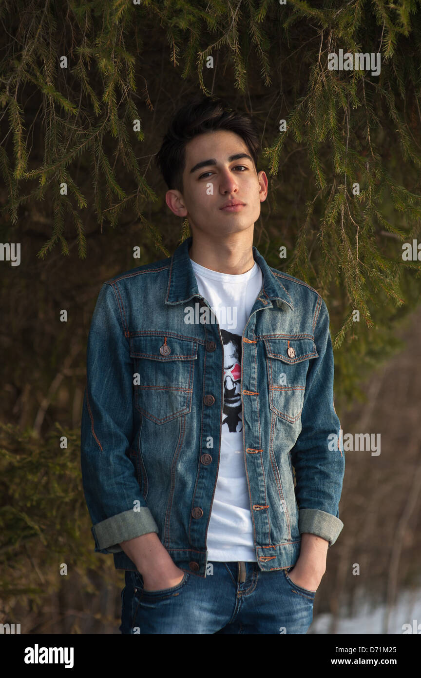 Young fashionable guy posing outside Stock Photo - Alamy