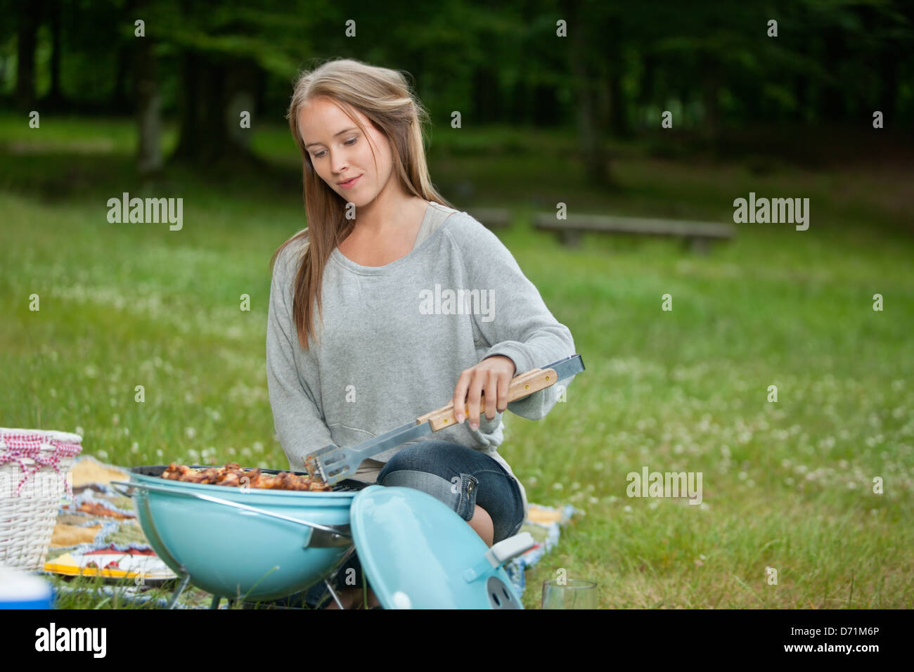 Young Female Cooking Food On Barbecue Stock Photo - Alamy