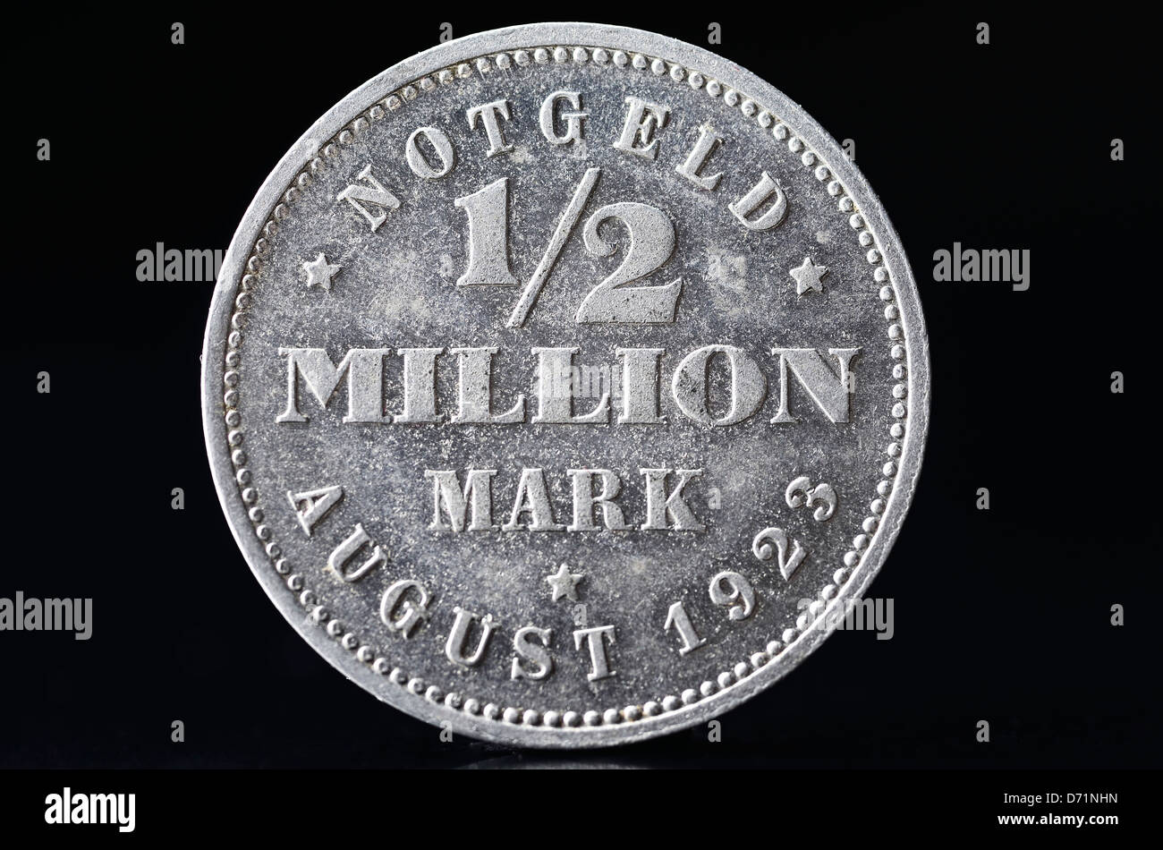 Coin with label 1/2 million DM, Hyperinflation Stock Photo - Alamy