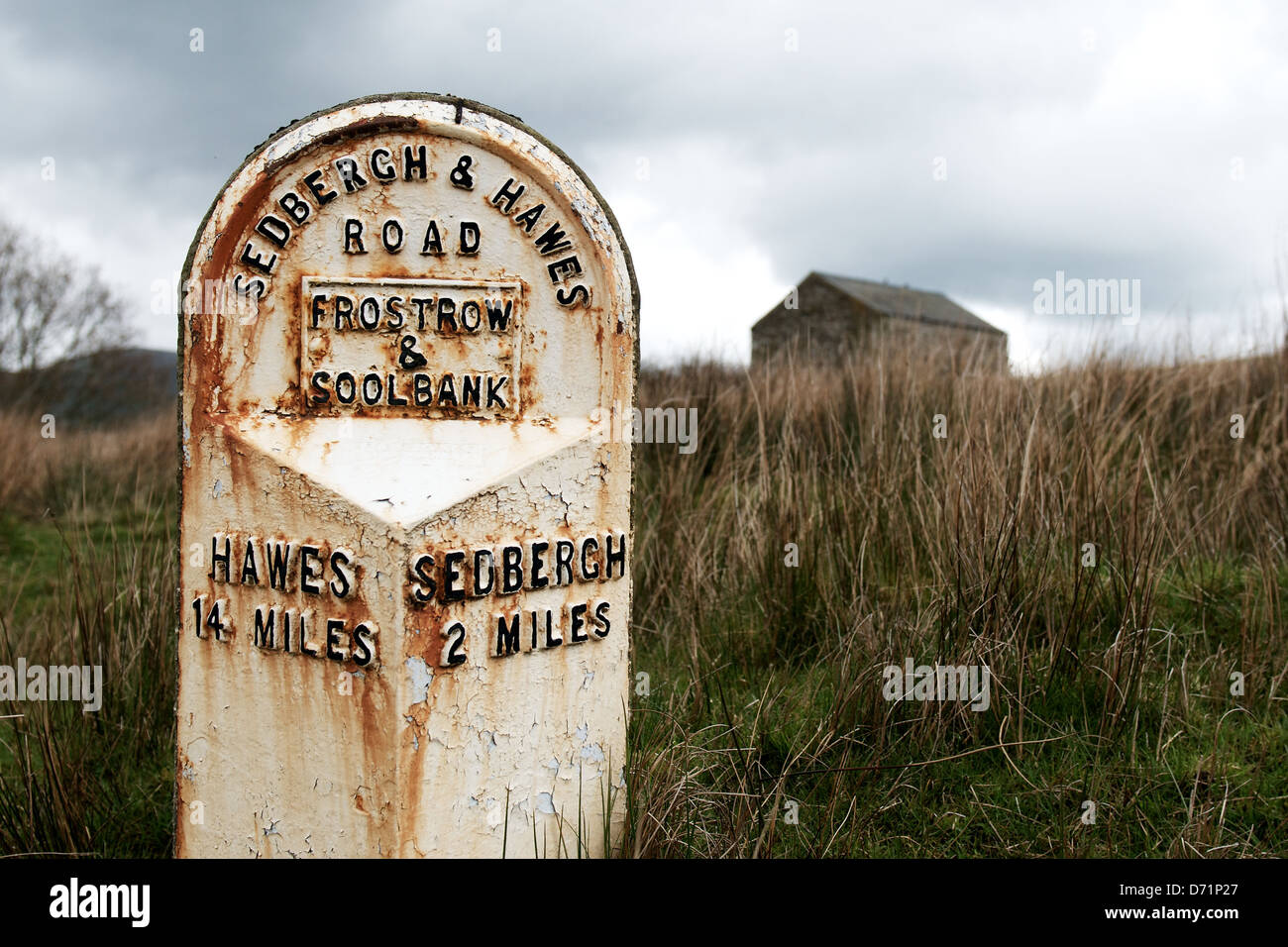 Sedbergh & Hawes Road Sign with old barn Stock Photo - Alamy